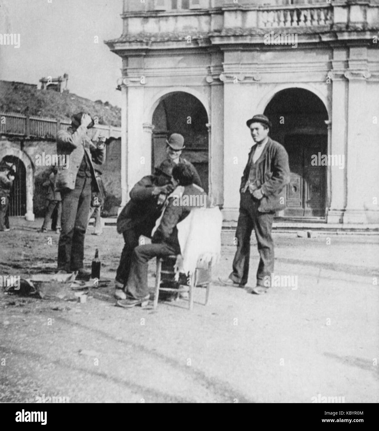 Barber outside Santa Bibiana church, ca. 1890 Stock Photo - Alamy