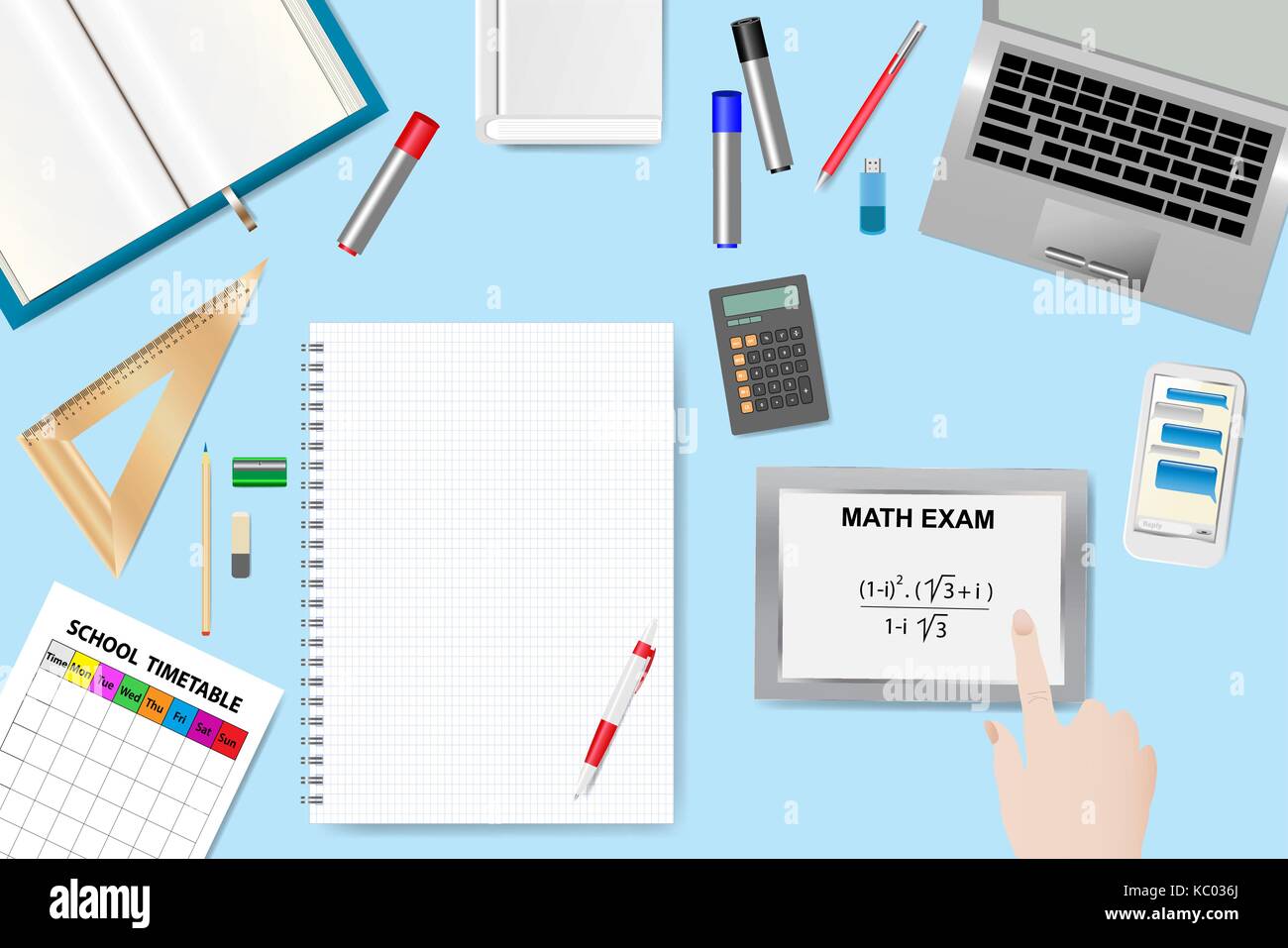 Top view of the student table. Empty notepad is in the middle of the ...