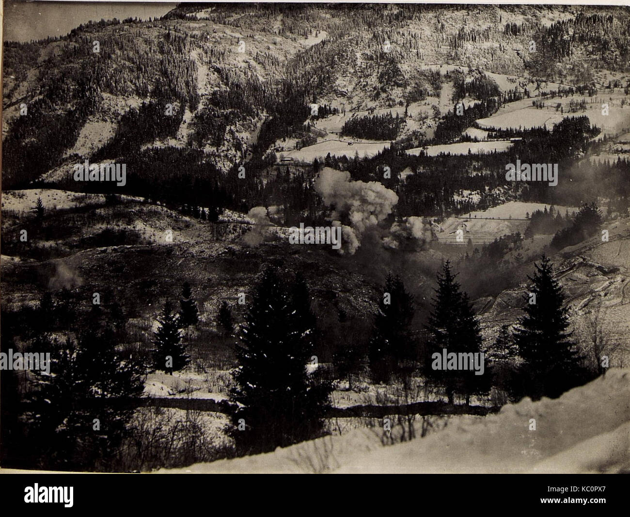 The image depicts a heavy mine explosion during military operations ...