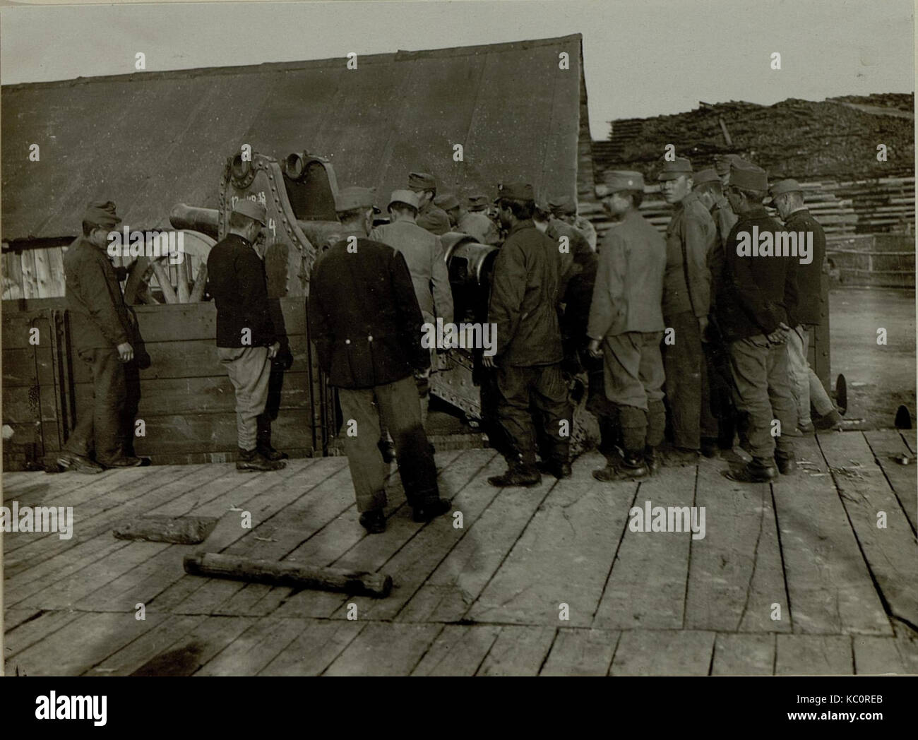 This photograph shows the loading of a 12 cm M.80 cannon for transport ...