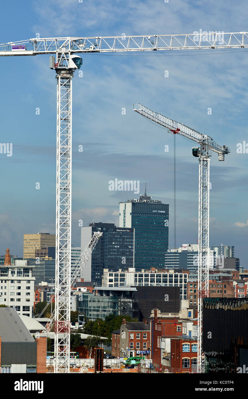 Manchester city centre skyline frames by tower cranes Stock Photo - Alamy