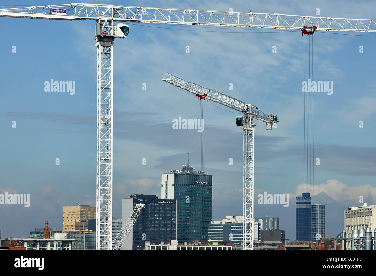Manchester city centre skyline frames by tower cranes Stock Photo - Alamy