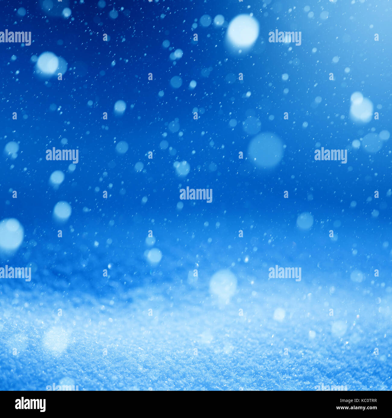 Art falling snow on the blue background Stock Photo - Alamy