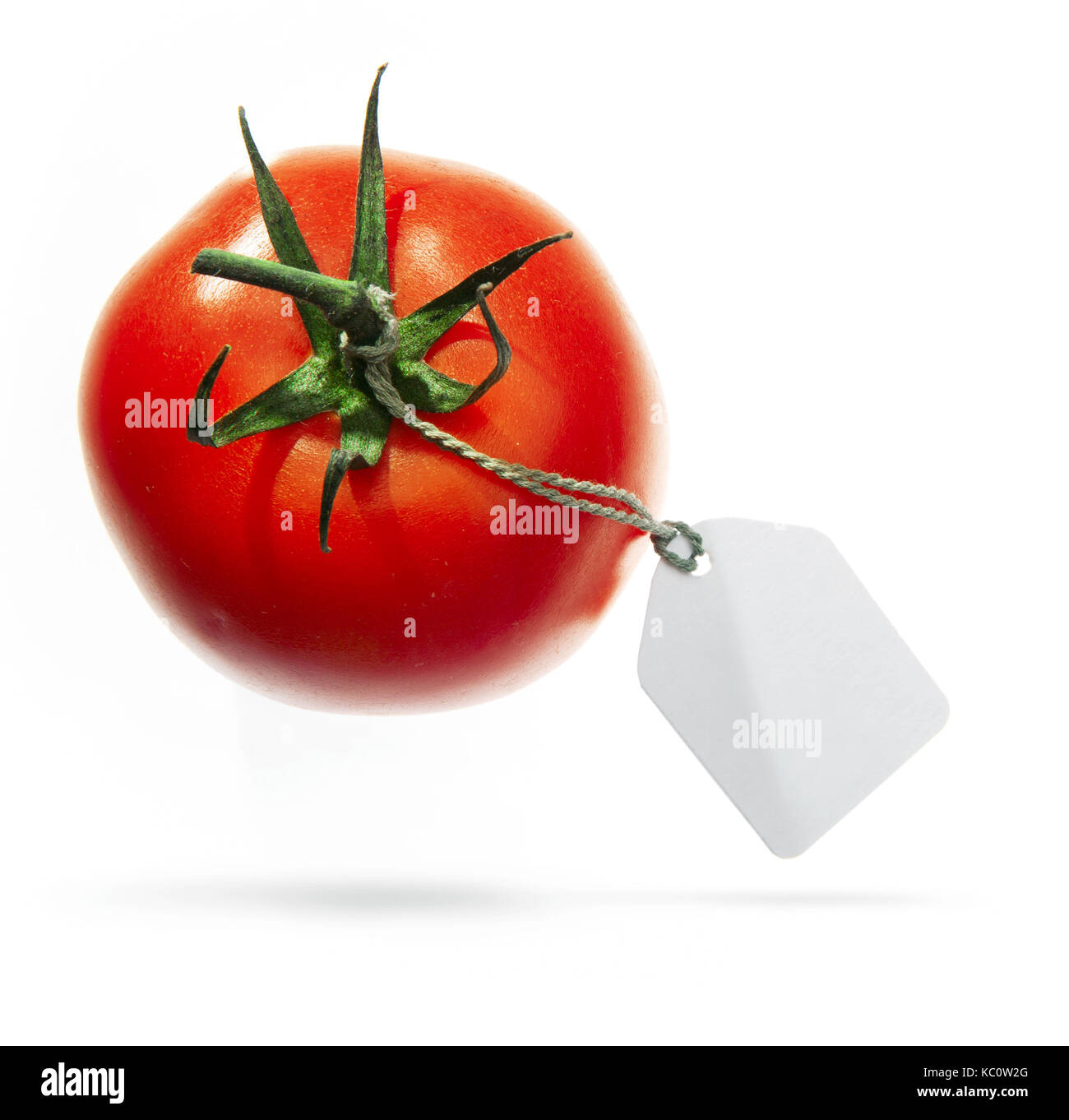 a red tomato with Sale Tags on a white background Stock Photo - Alamy