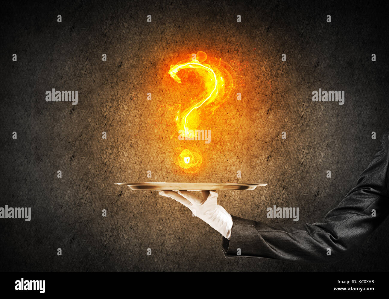 Hand of waitress presenting flaming question mark Stock Photo - Alamy