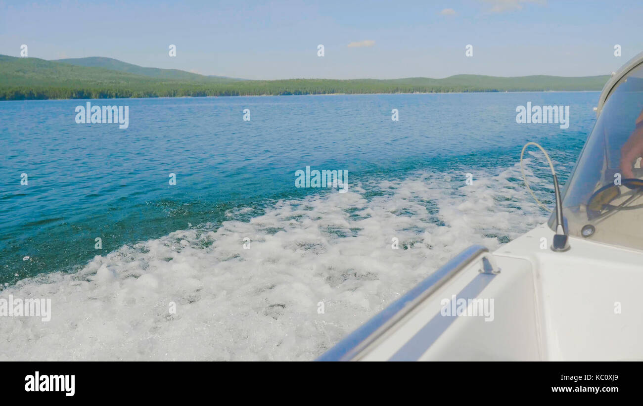 Wave foam splash that made form the boat's motor in lake. Waves and ...