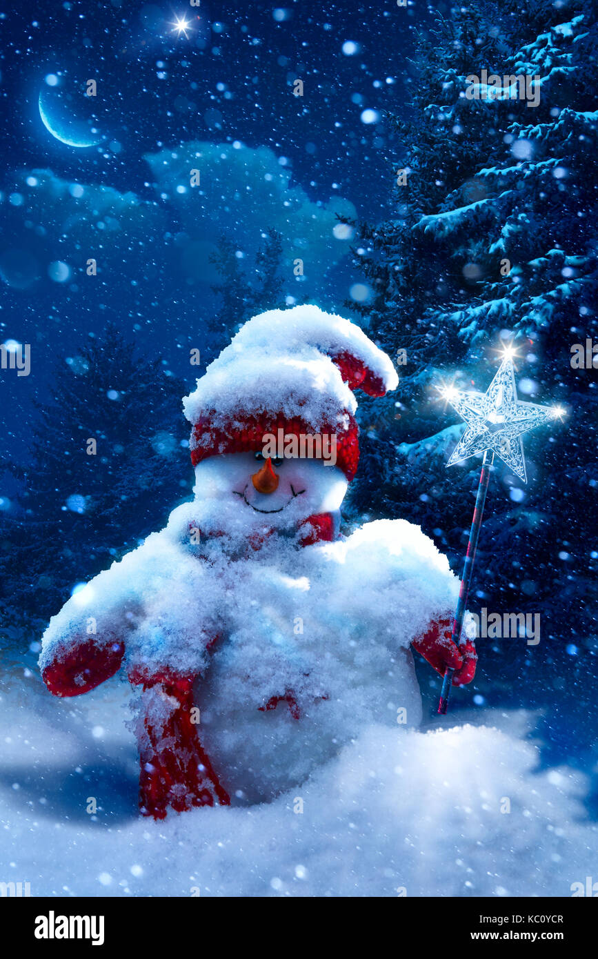 Art Christmas snowman and fir branches covered with snow Stock Photo ...