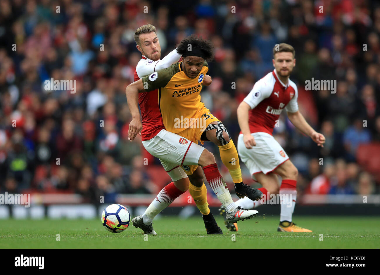 Brighton & Hove Albion's Izzy Brown (right) and Arsenal's Aaron Ramsey ...