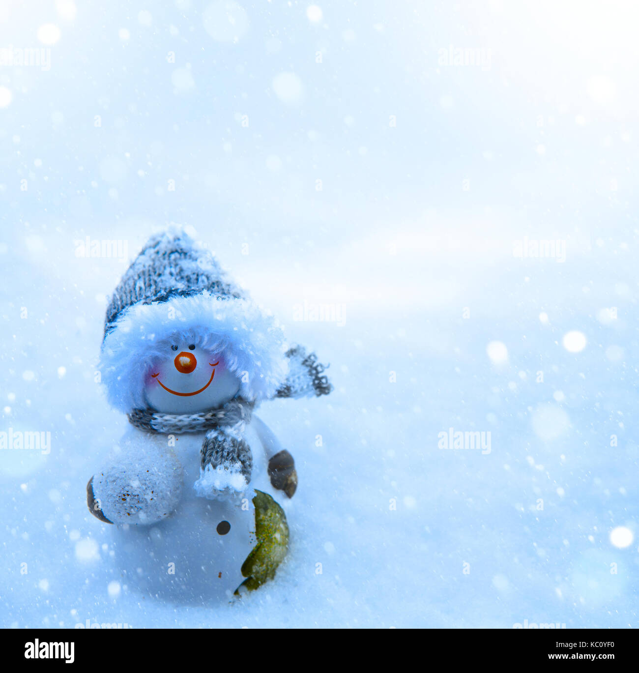 Art Christmas snowman and blue snow background Stock Photo - Alamy