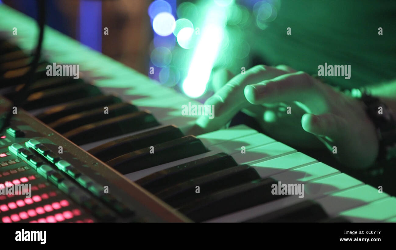 Closeup Of Male Hands Playing Piano. Man Playing The Synthesizer ...