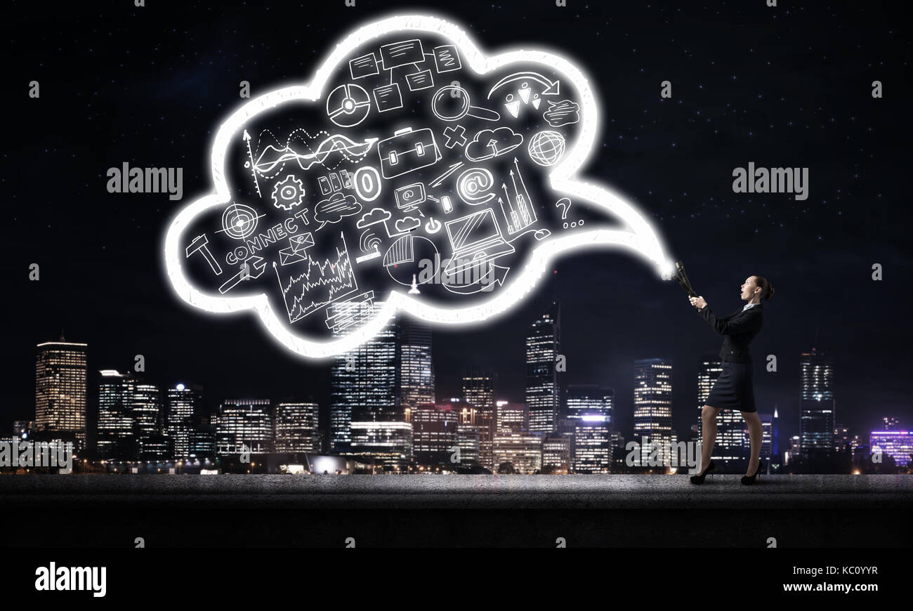 Woman throwing light on her ideas Stock Photo - Alamy