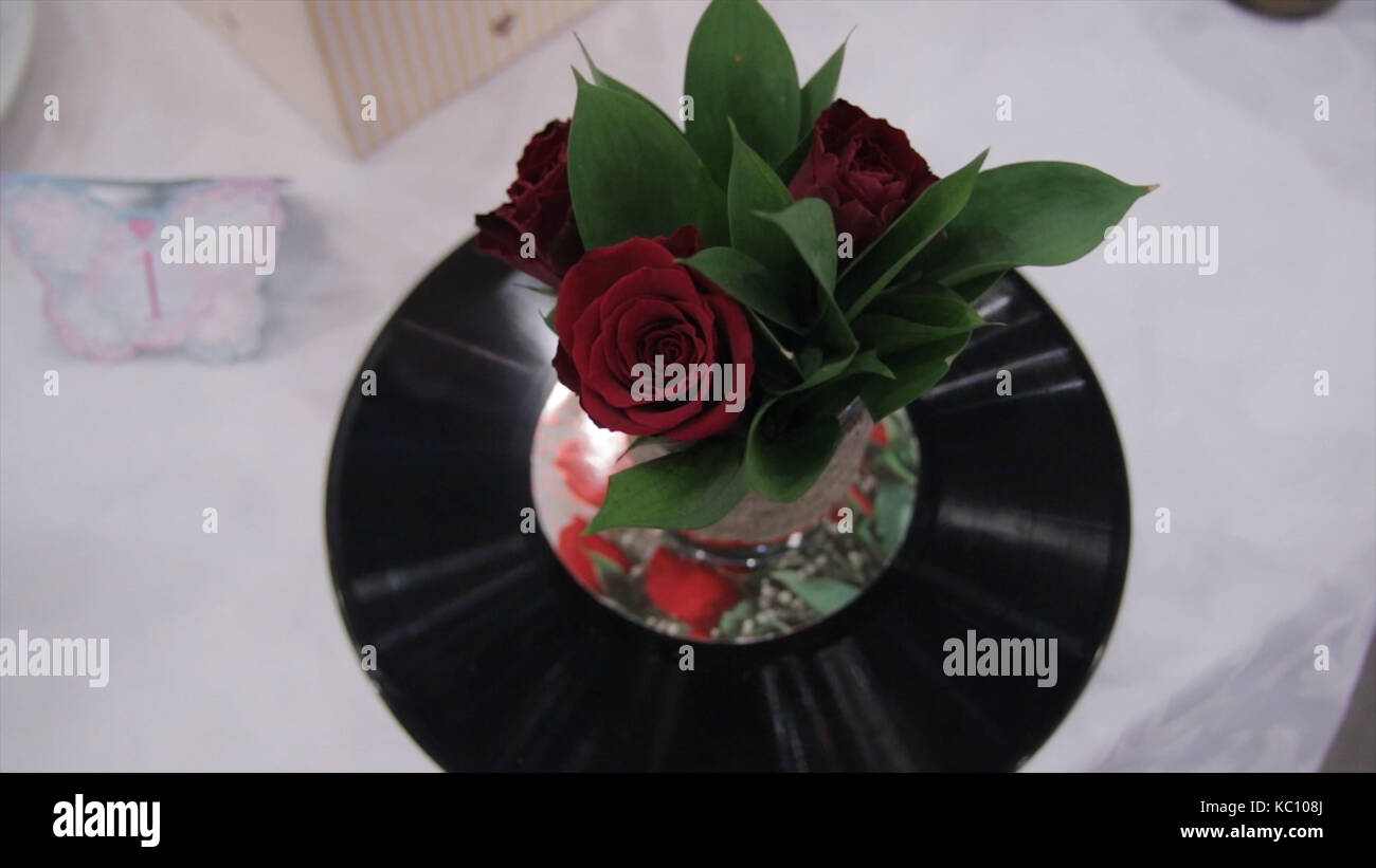 Musical bouquet of roses and record. Beautiful bouquet r of red roses ...