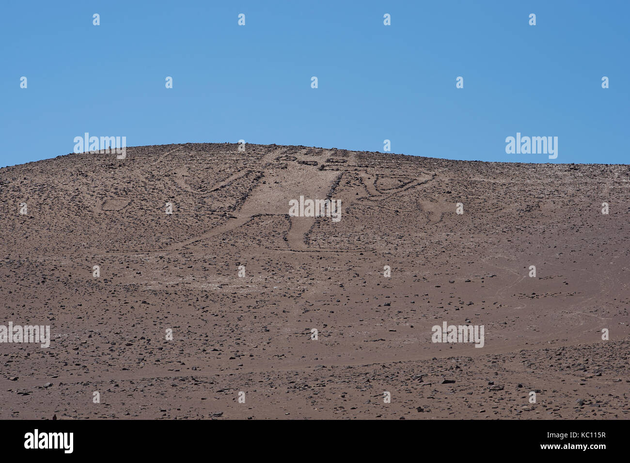 Giant of the Atacama. Large petroglyph on a rocky outcrop in the ...
