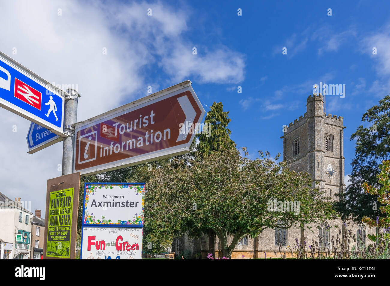 Sign board and church in Axminster, Devon Stock Photo - Alamy