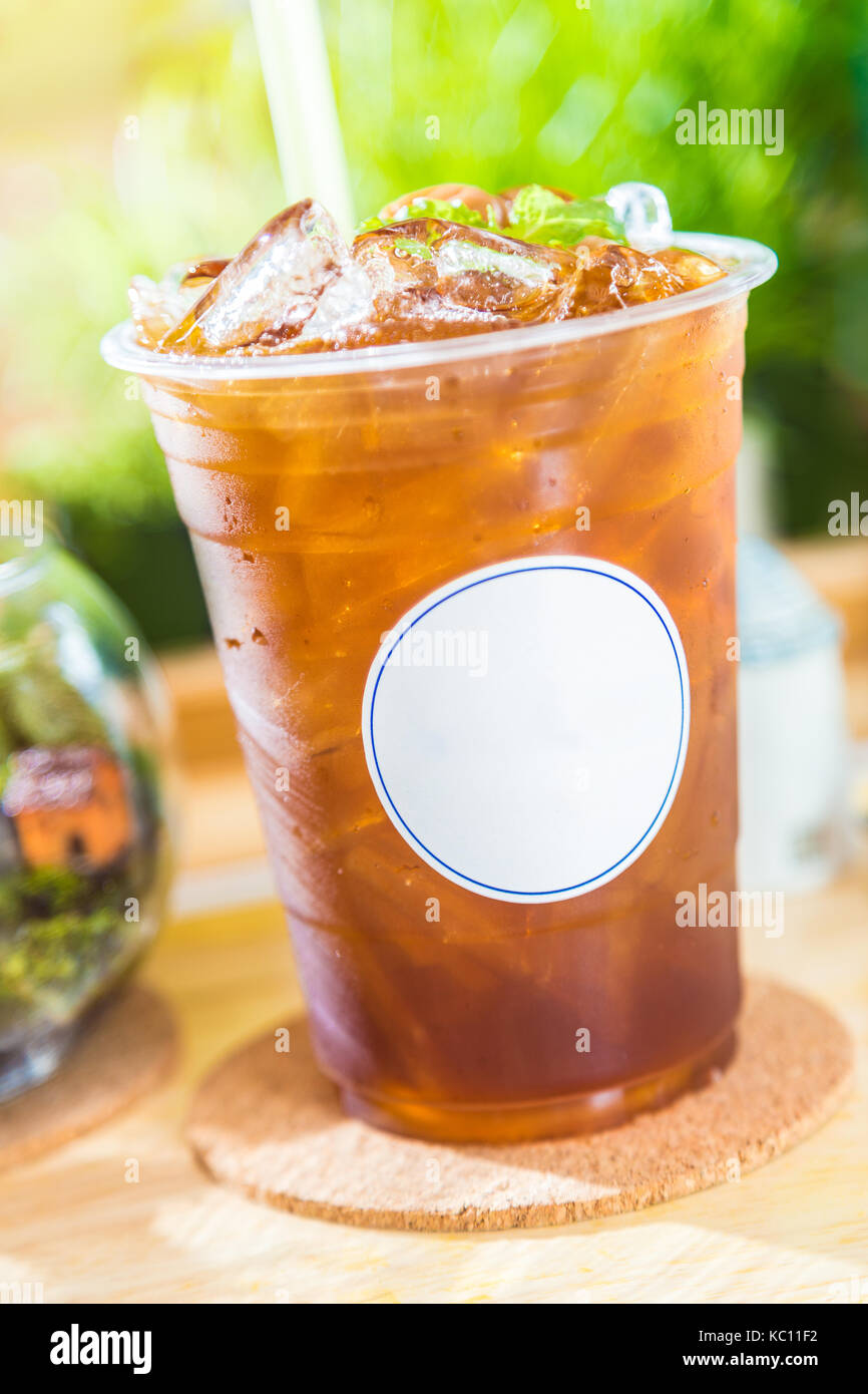 iced minted logan tea drink on wooden tray, selective focus with ...