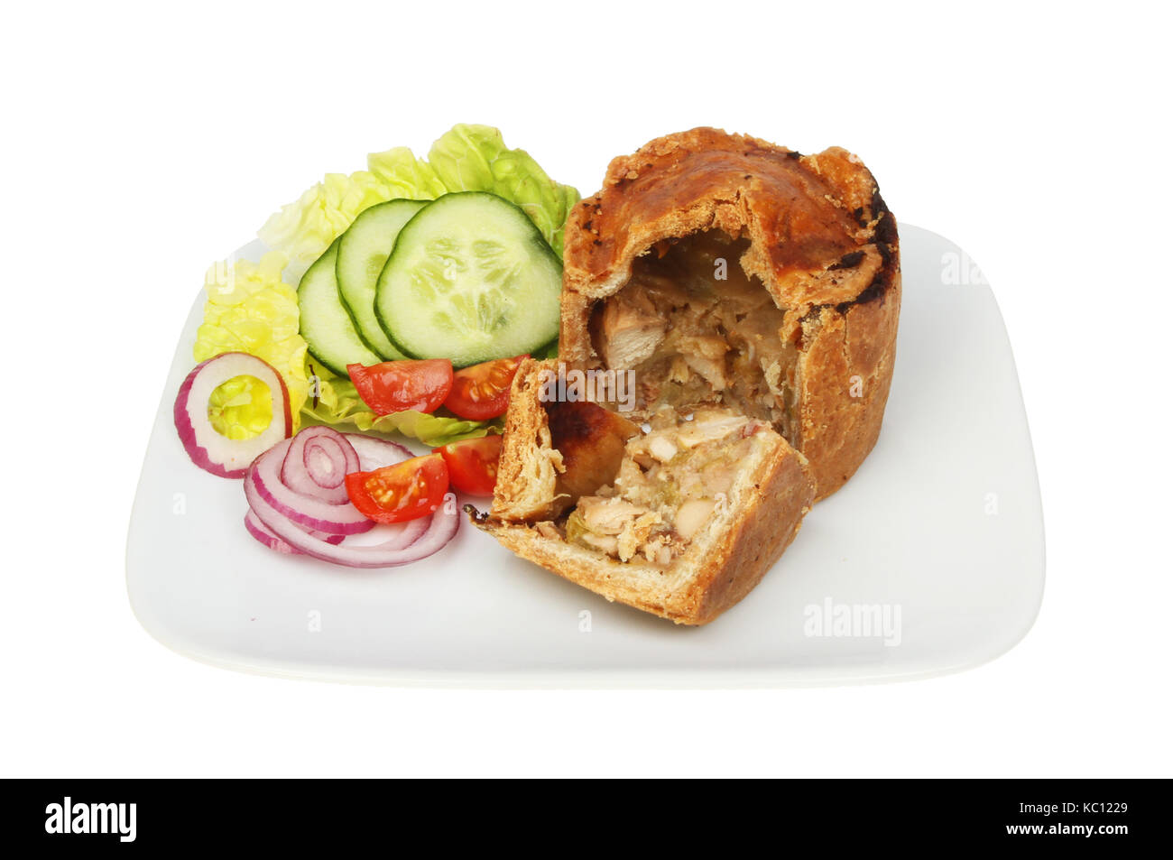 Cold meat pie and salad on a plate isolated against white Stock Photo ...