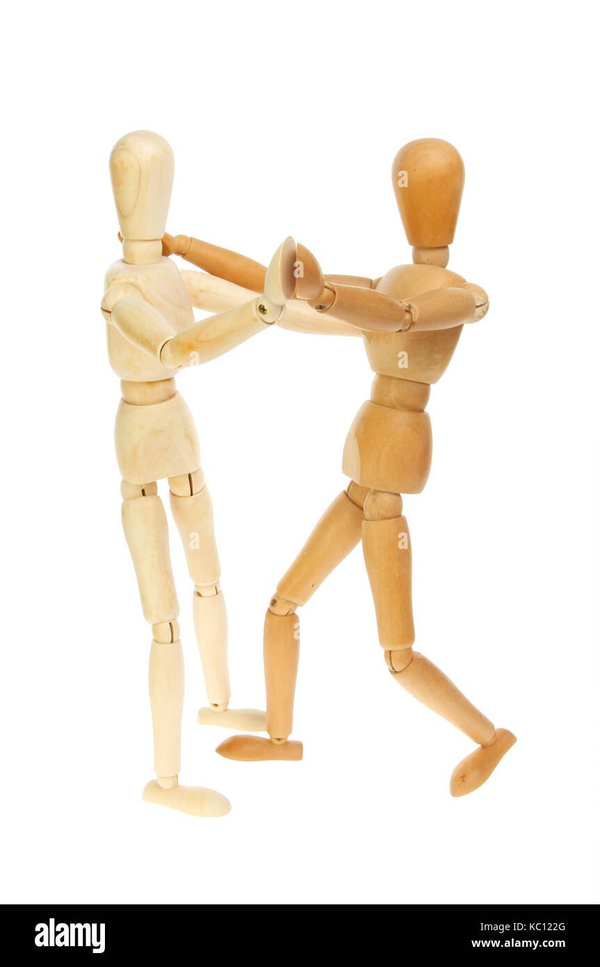 Two dancing wooden manikins isolated against white Stock Photo - Alamy