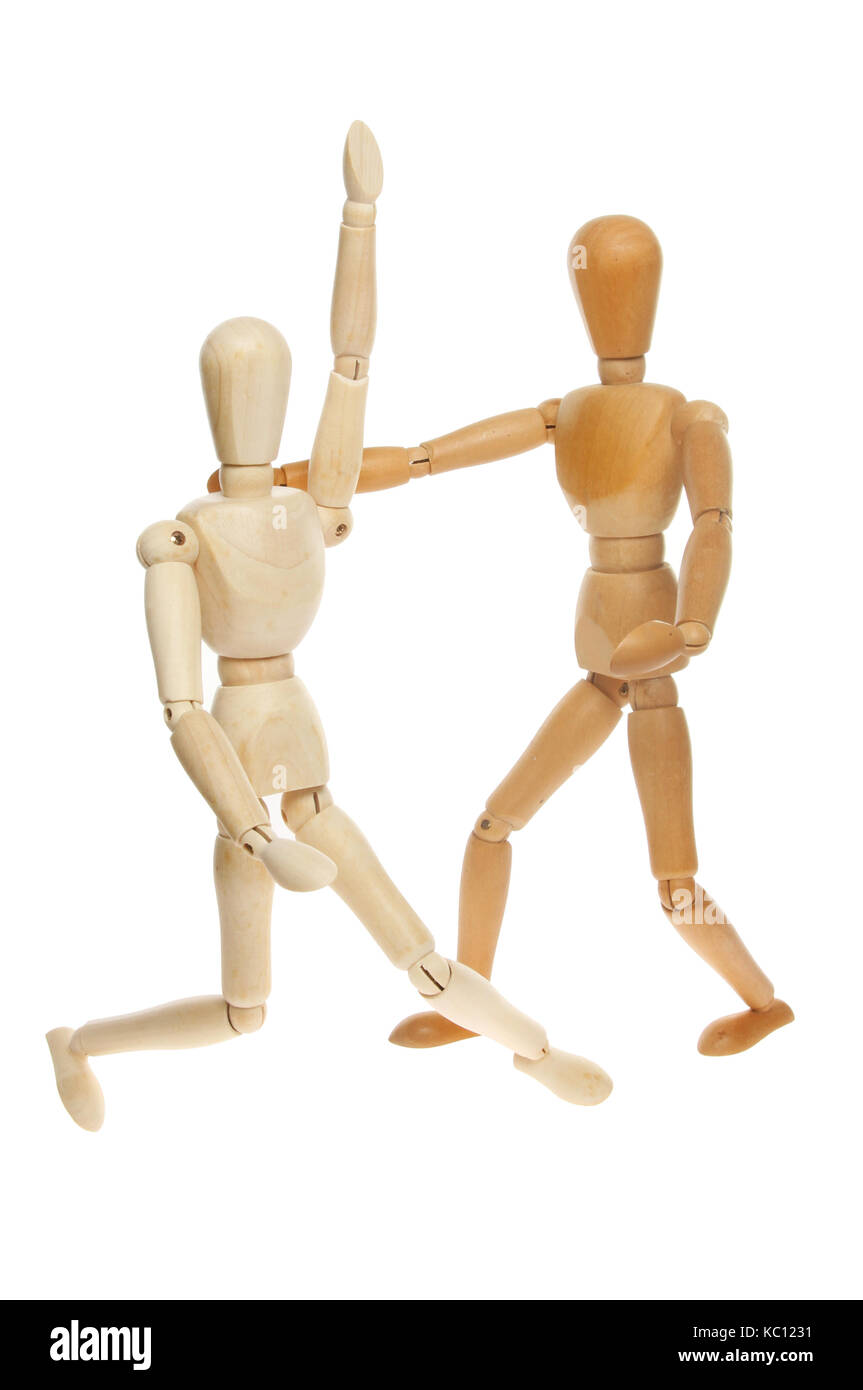 Two wooden artist's manikins dancing isolated against white Stock Photo ...