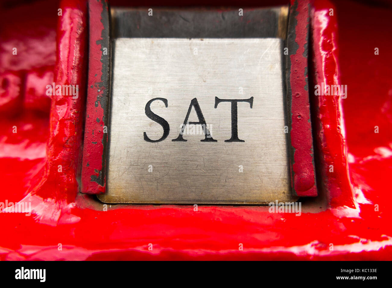 Day of the week letter collection plate / next collection sign on a red ...