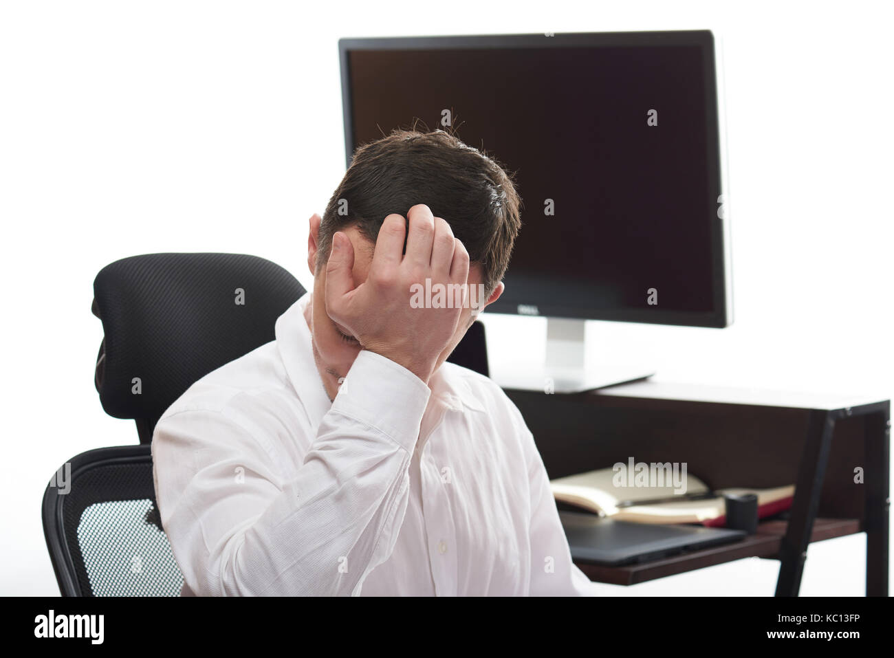 Business man under stress in office background. Young man with ...