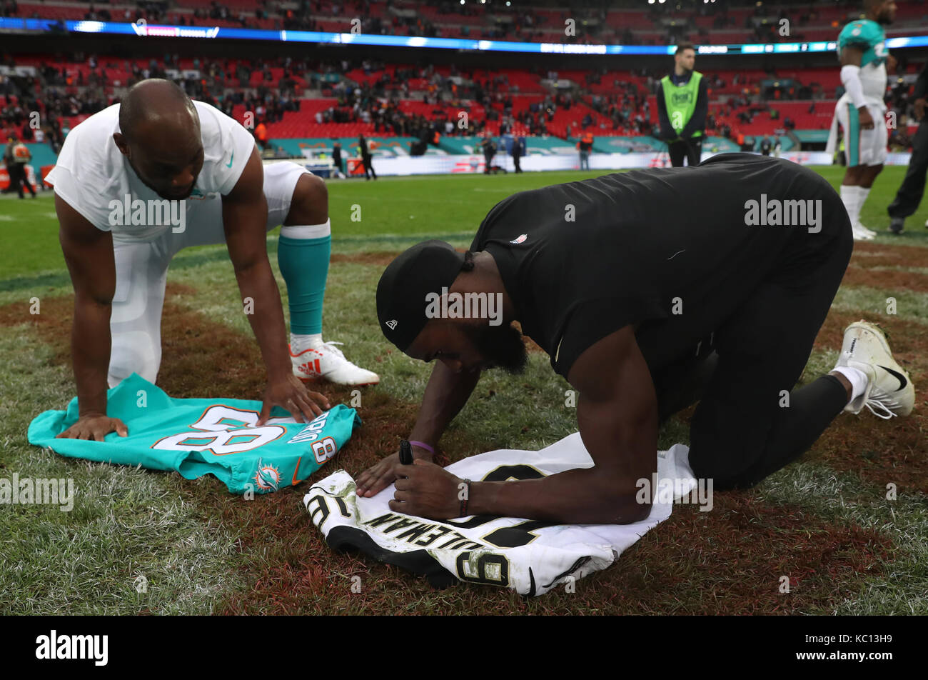 Miami Dolphins' Leonte Carroo (left) and New Orleans Saints' Brandon ...