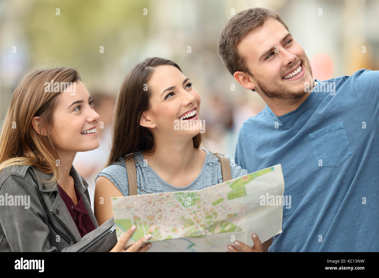 Happy family with travel map hi-res stock photography and images - Alamy