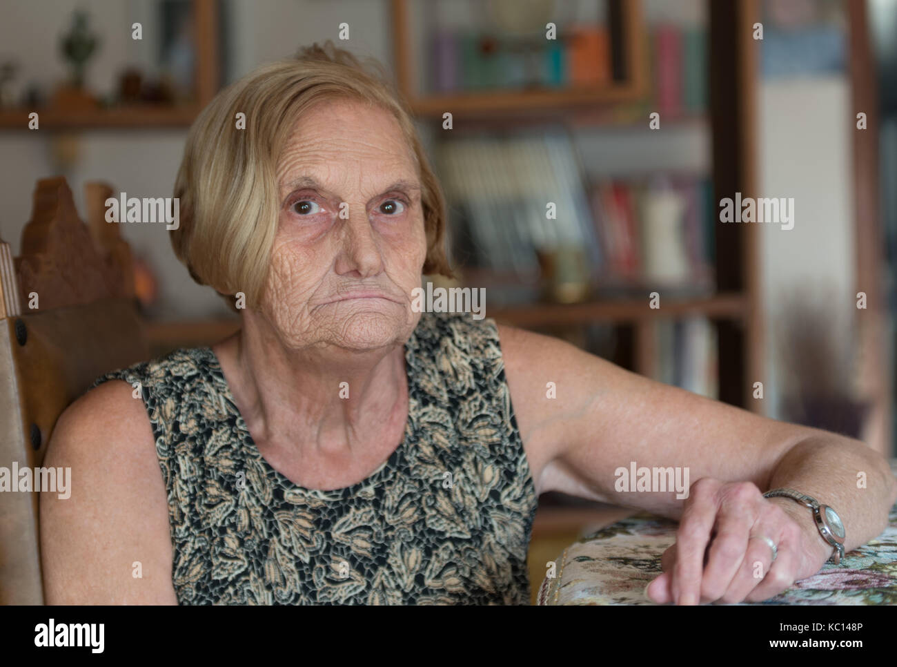 Serious senior woman looking to camera at home, close up Stock Photo ...