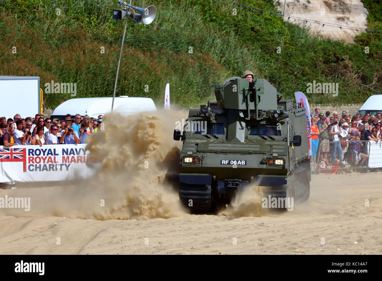 Royal Marines Viking armoured personnel carrier dusting up sand while ...