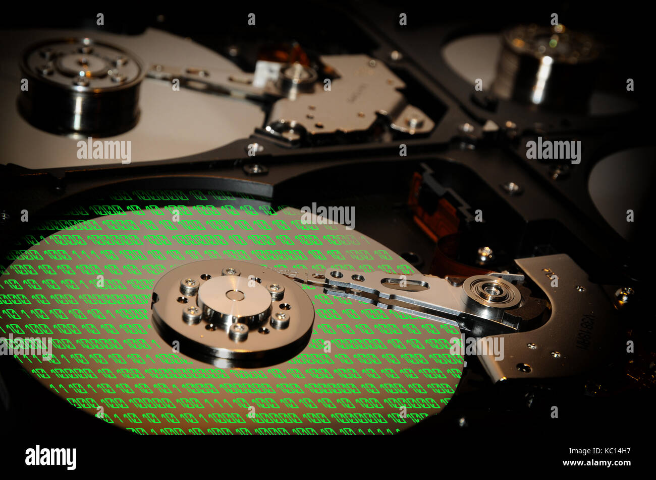 close up of open hard disk with binary effects Stock Photo - Alamy