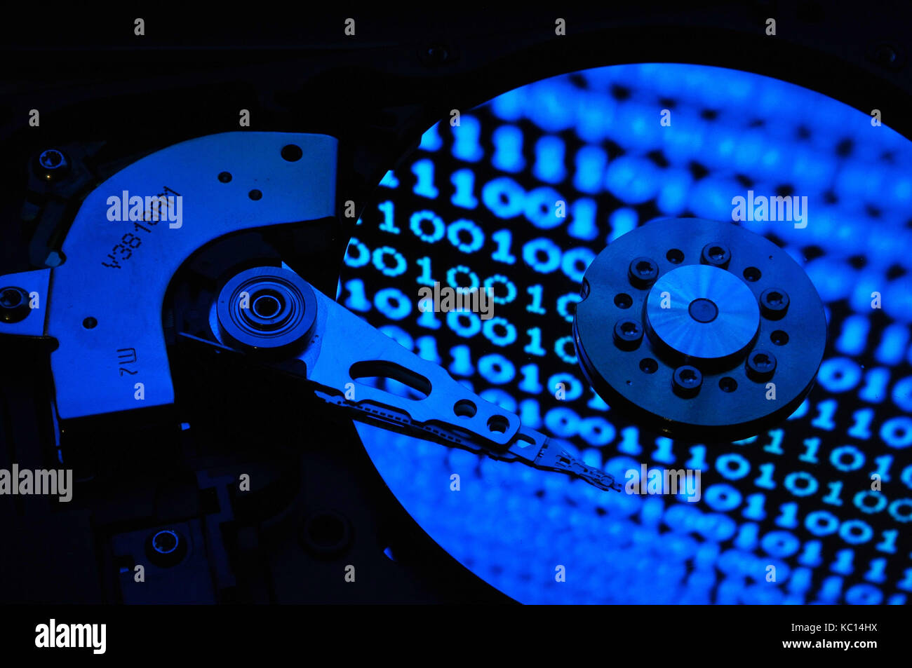 close up of open hard disk with binary effects Stock Photo - Alamy