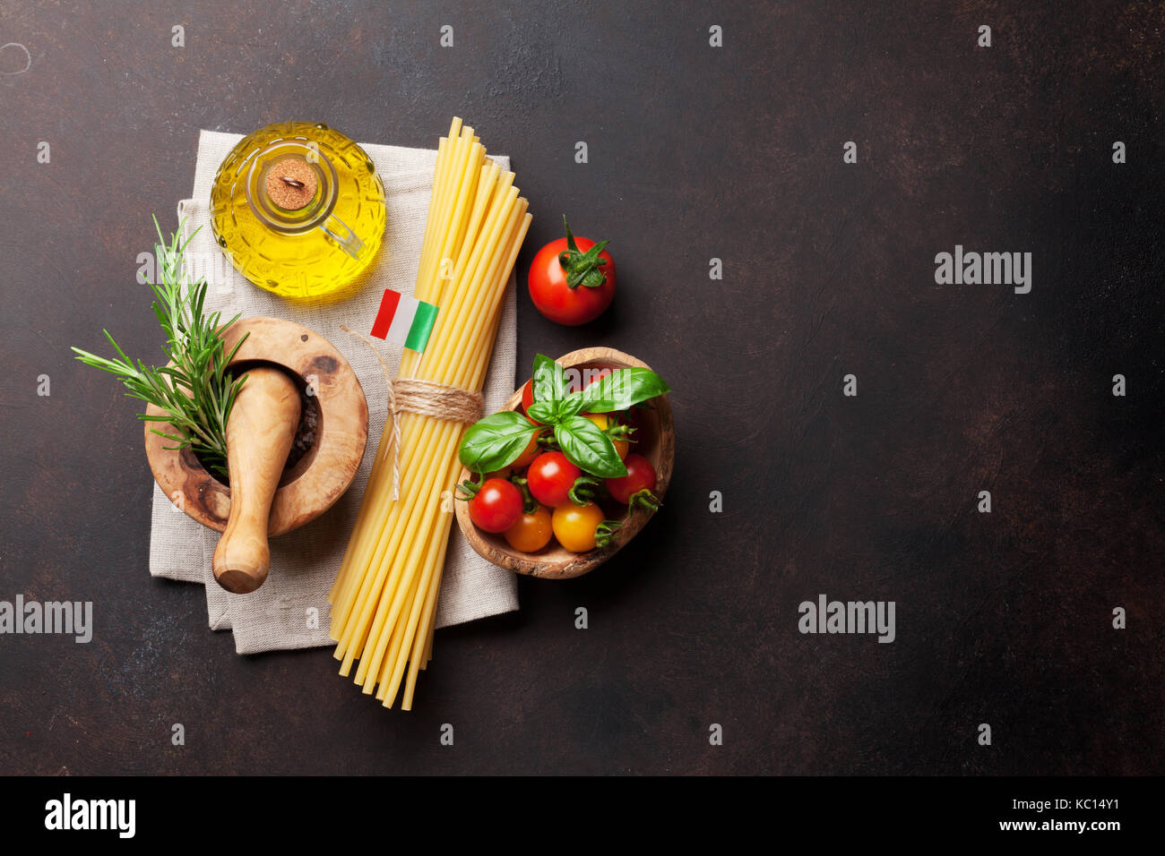 Italian food. Pasta ingredients on stone table. Top view with space for ...