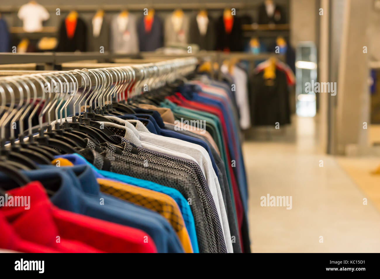 Variety of clothes hanging on rack in boutique, fashion and shopping ...