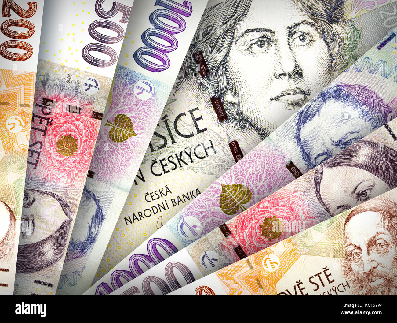 Different money bills stacked over each other forming a money ...