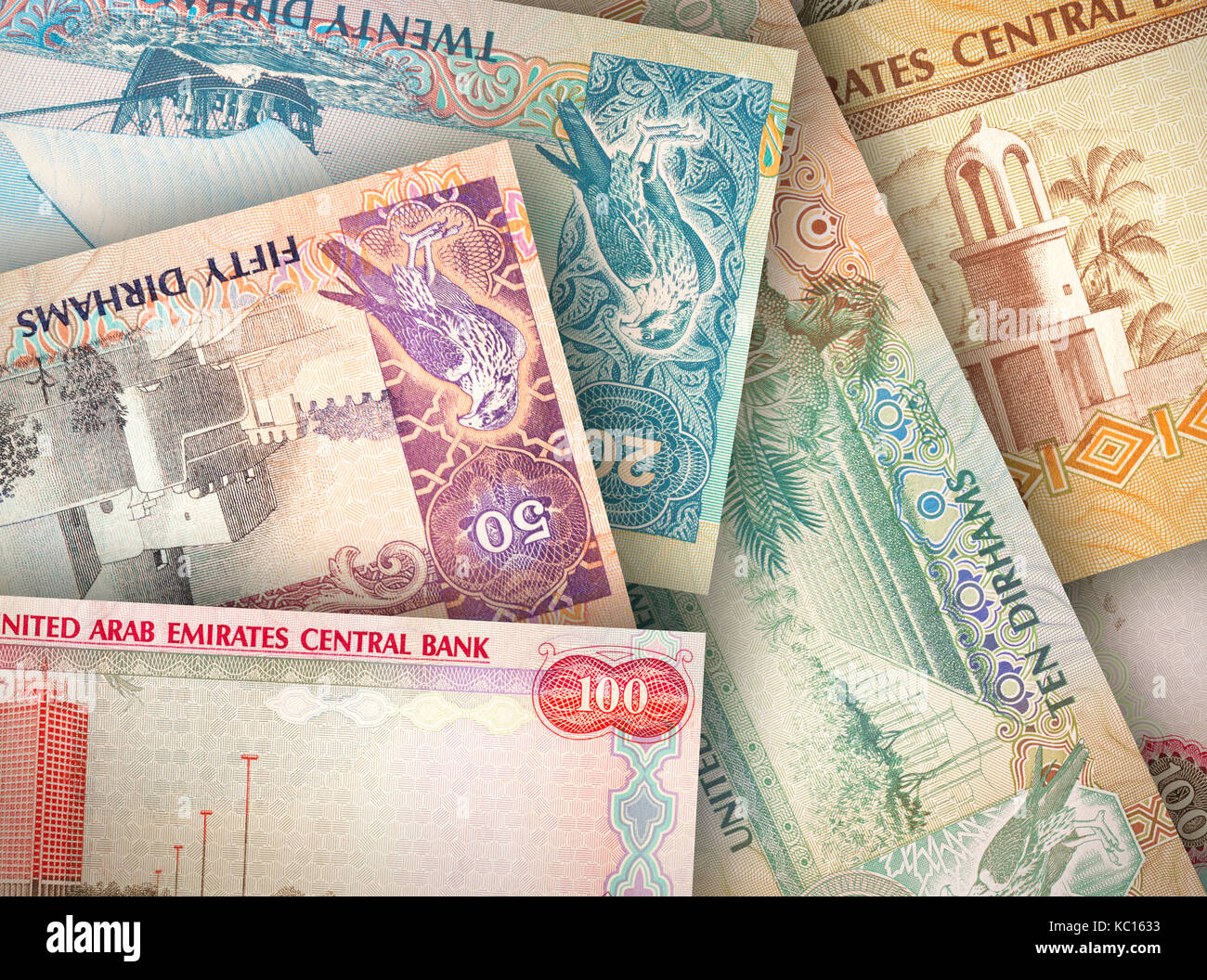 Different money bills stacked over each other forming a money ...