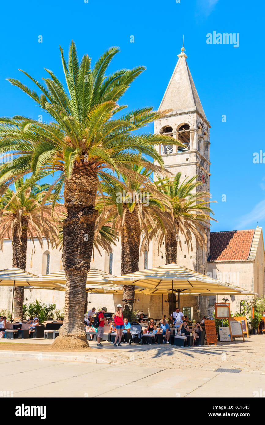 TROGIR, CROATIA - SEP 6, 2017: church tower with palm tree in old town ...