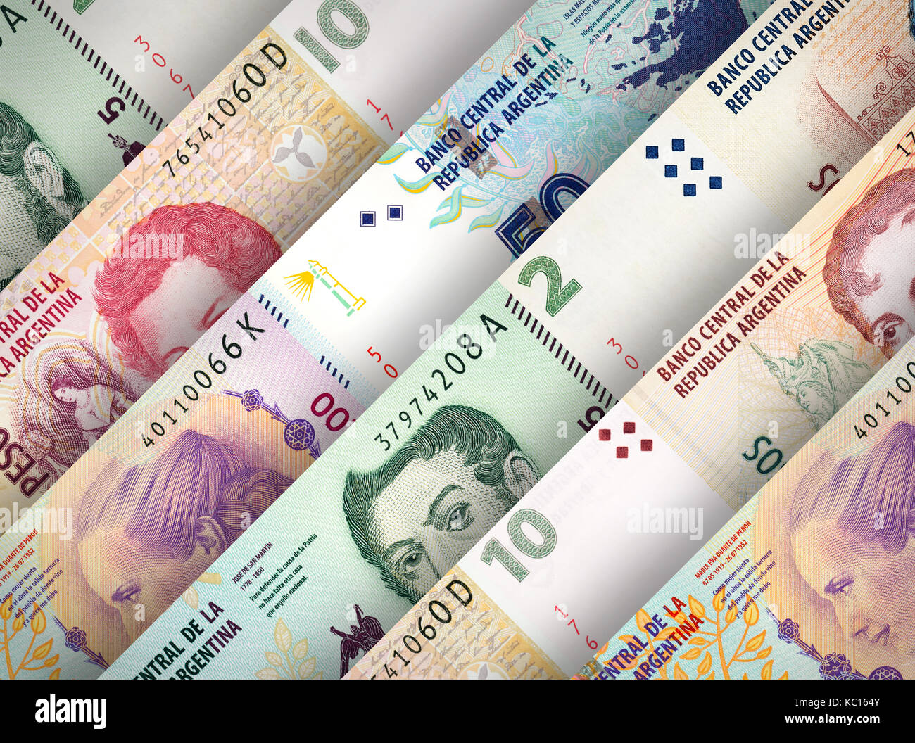Different money bills stacked over each other forming a money ...