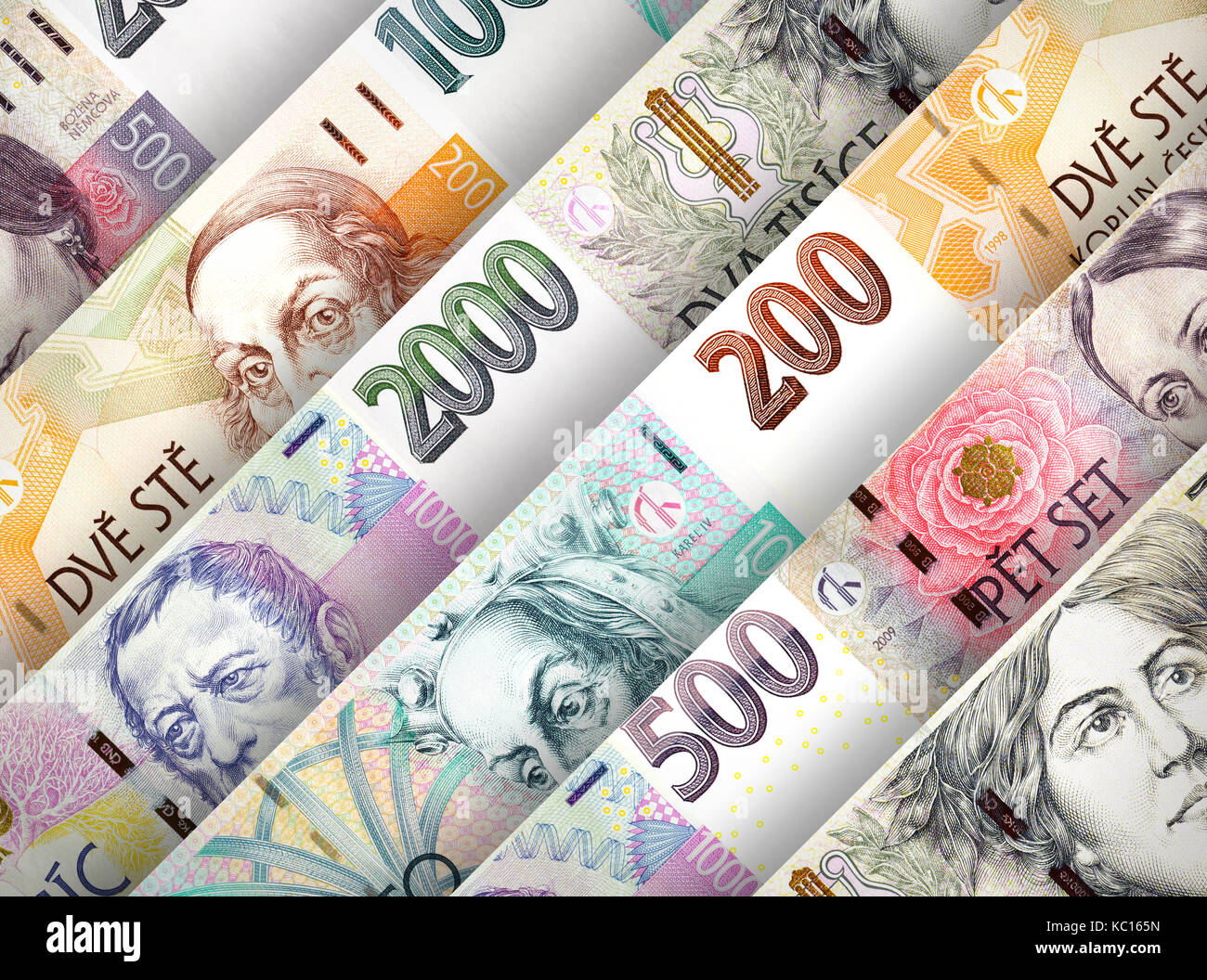 Different money bills stacked over each other forming a money ...