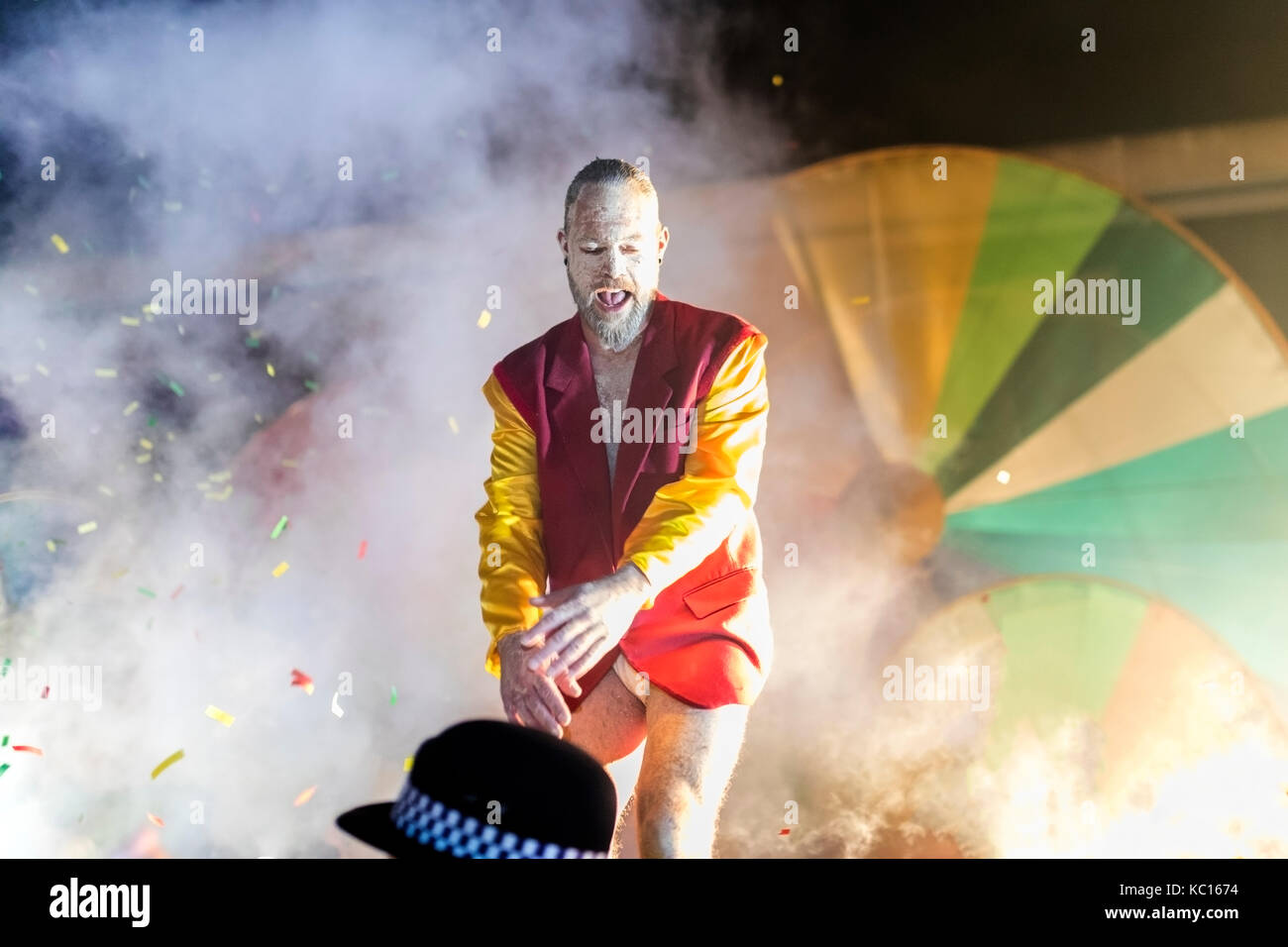 Street festival performer dancing in front of a crowd of people with ...
