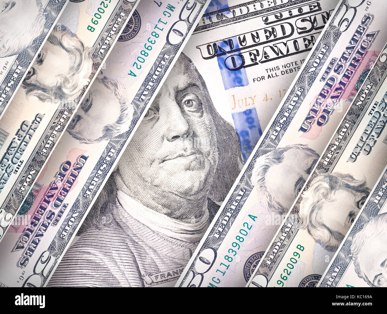 Different money bills stacked over each other forming a money ...