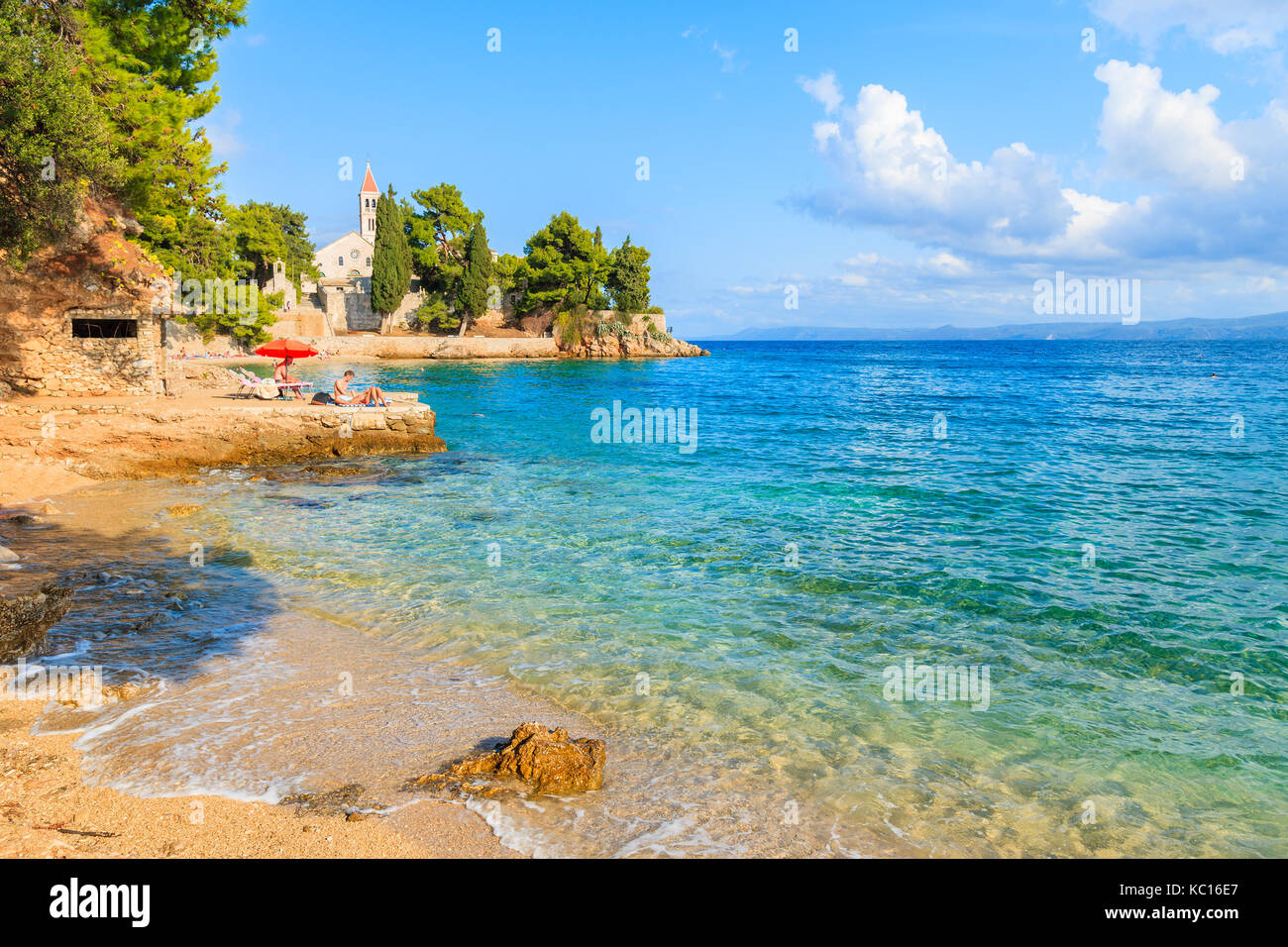 BOL TOWN, CROATIA - SEP 8, 2017: Beach with azure sea water and view of ...