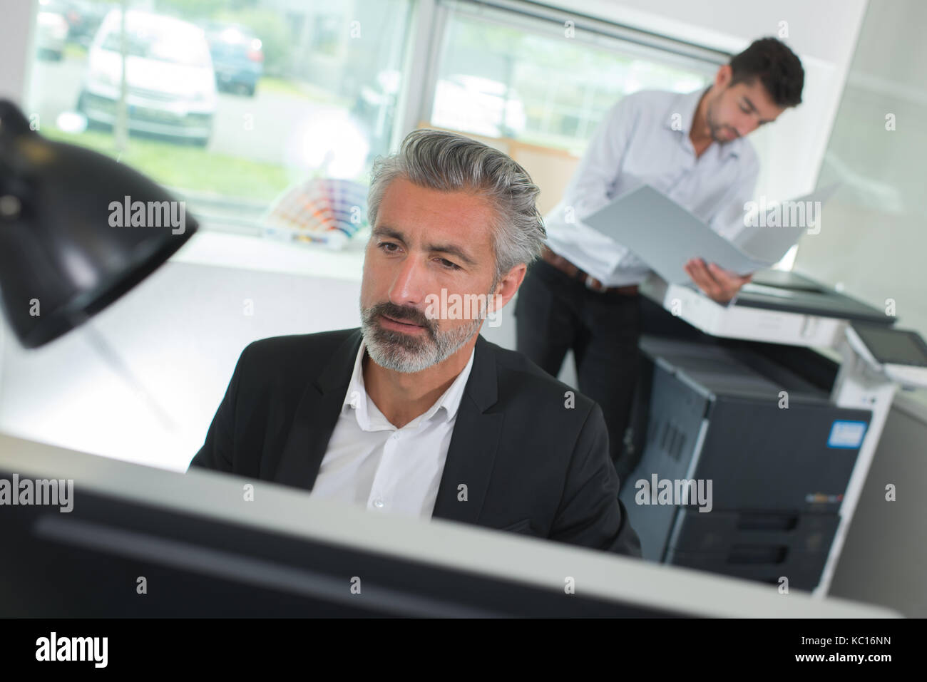 Man at work in office Stock Photo - Alamy