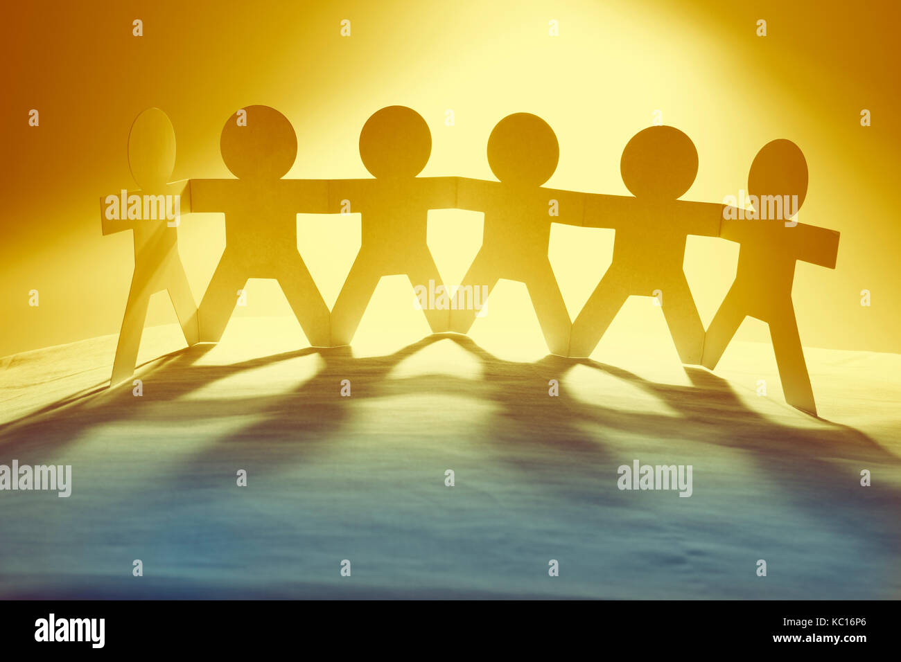 Team of paper chain people Stock Photo - Alamy