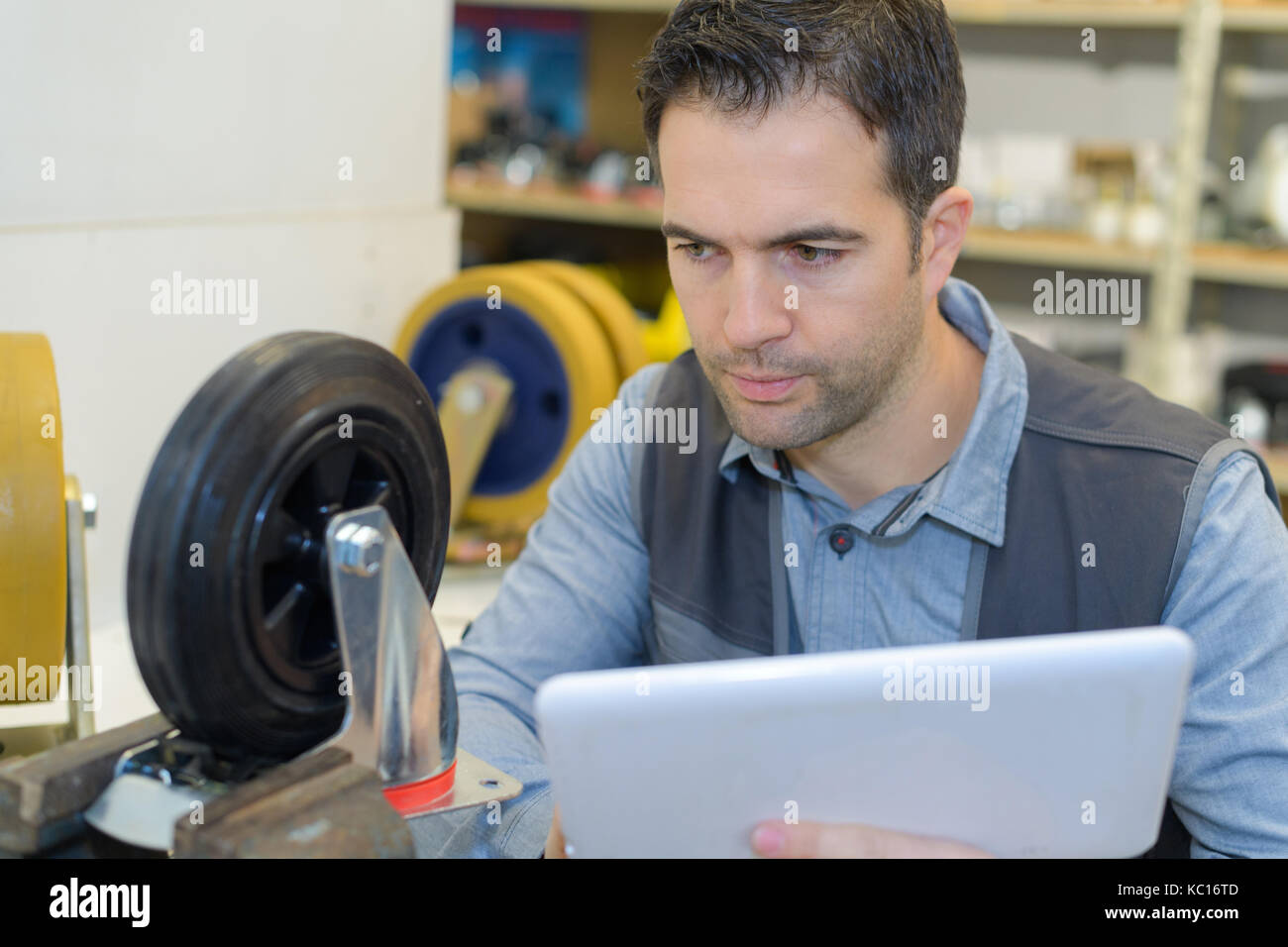 quality control manager in the workshop Stock Photo - Alamy
