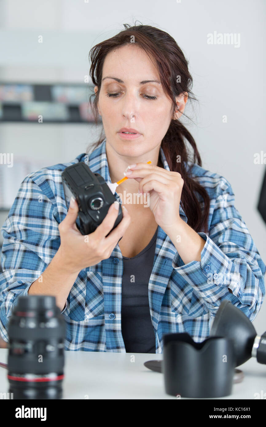 woman cleaning camera Stock Photo - Alamy