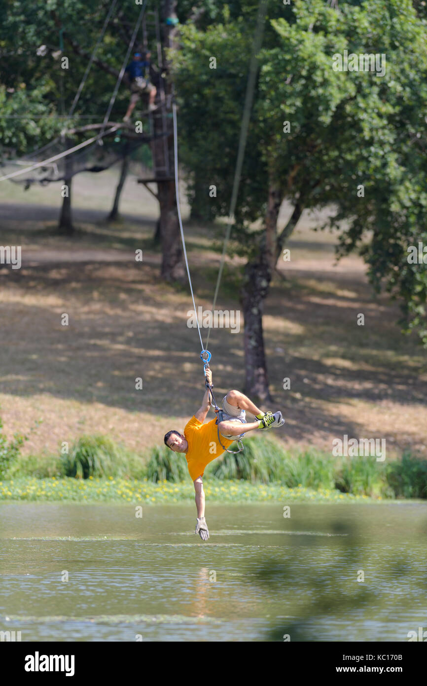 excited man climbing cliff in canyon with rope Stock Photo - Alamy