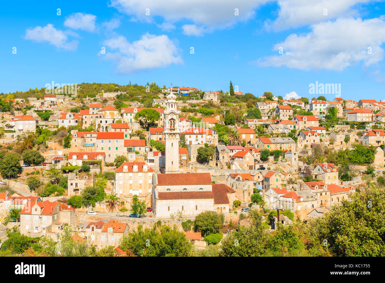 View of Lozisca village with colorful houses and church, Brac island ...