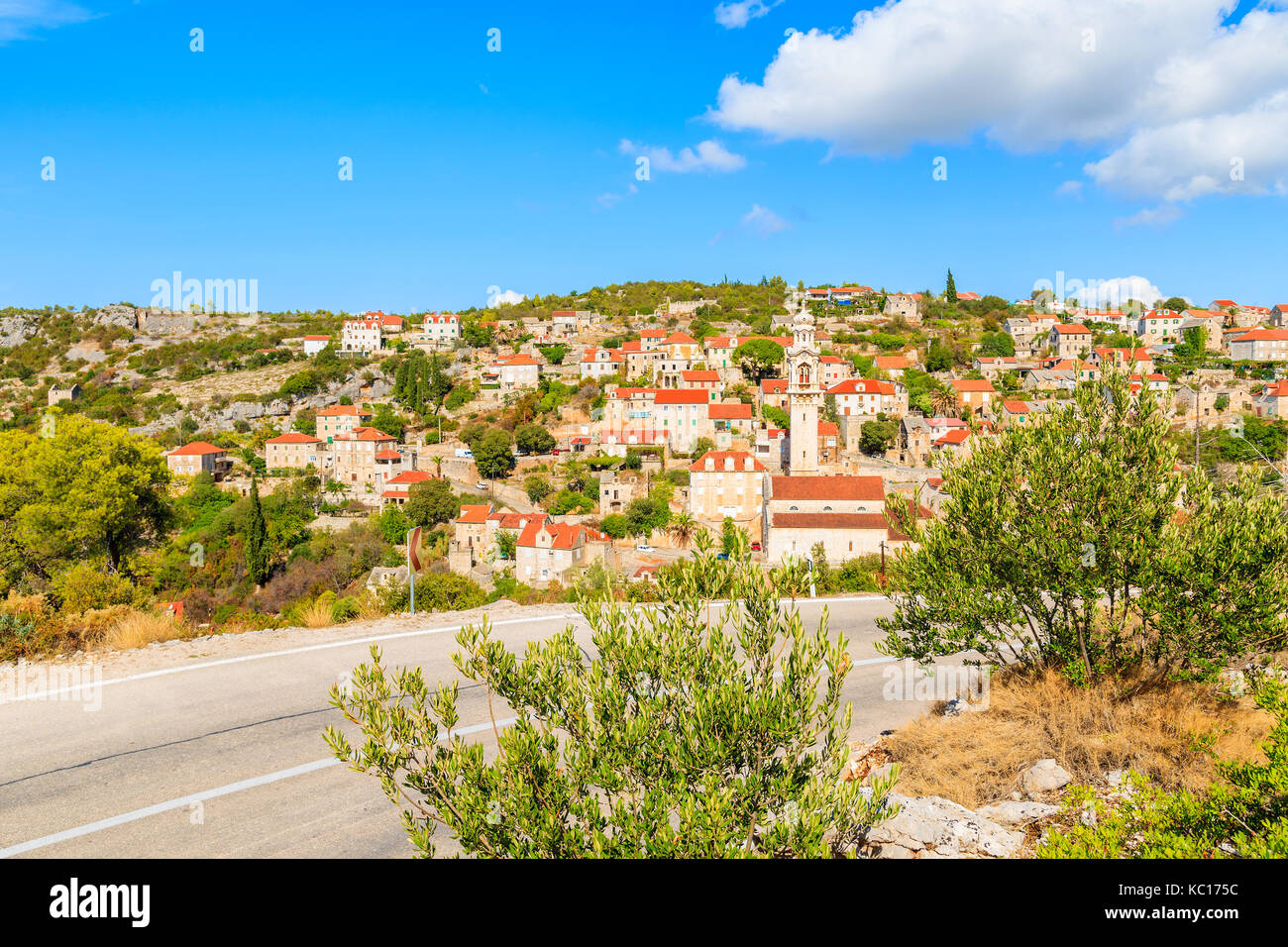 Road to Lozisca village with colorful houses and church, Brac island ...