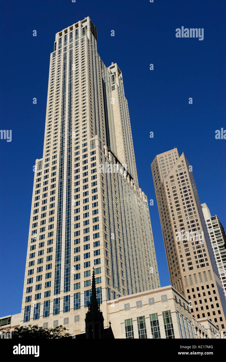 Building towering above the city Stock Photo - Alamy