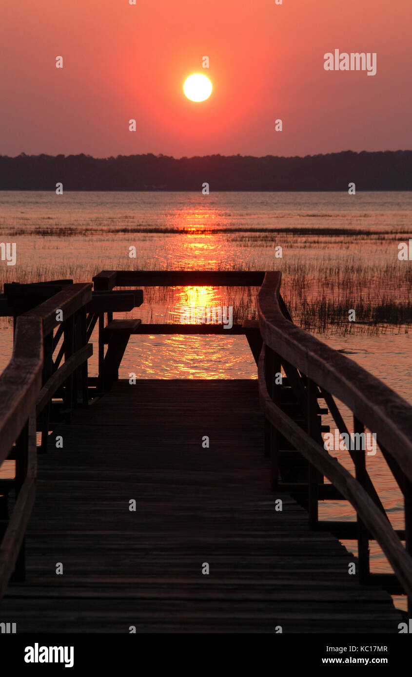 Boat dock with sunset Stock Photo - Alamy