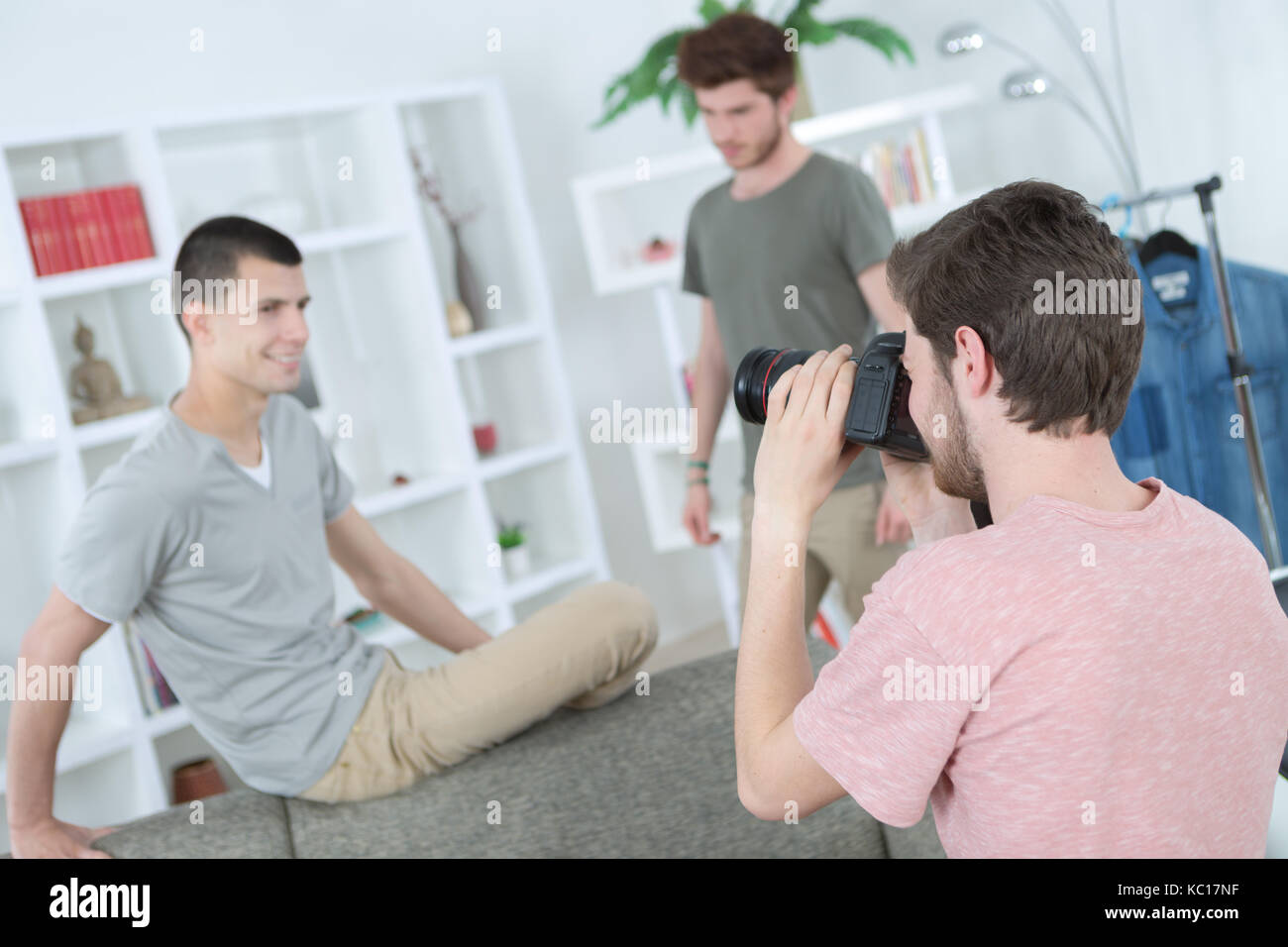 male photographer working in studio with two models Stock Photo - Alamy